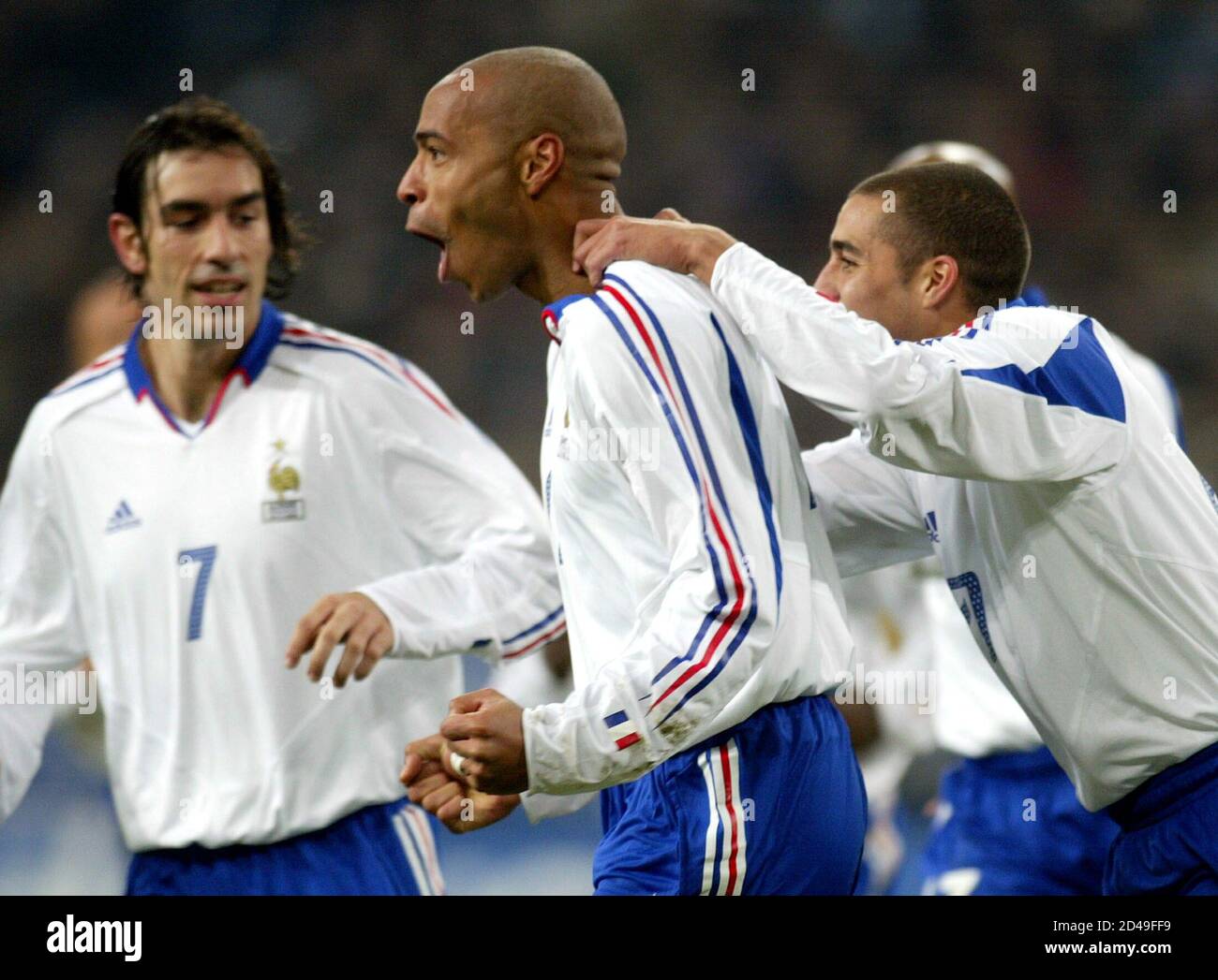 Robert pires and thierry henry celebrate robert pires goal hi-res stock ...