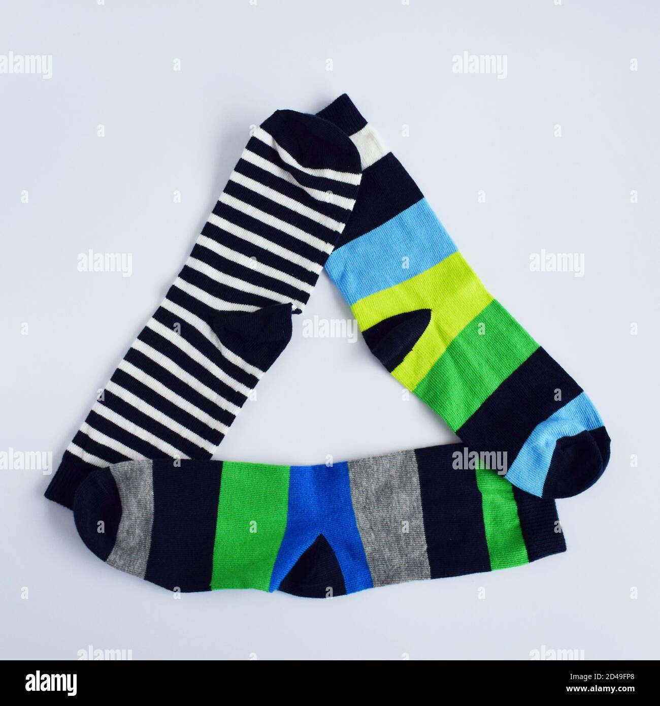 triangle of colorful socks on pure white background Stock Photo - Alamy