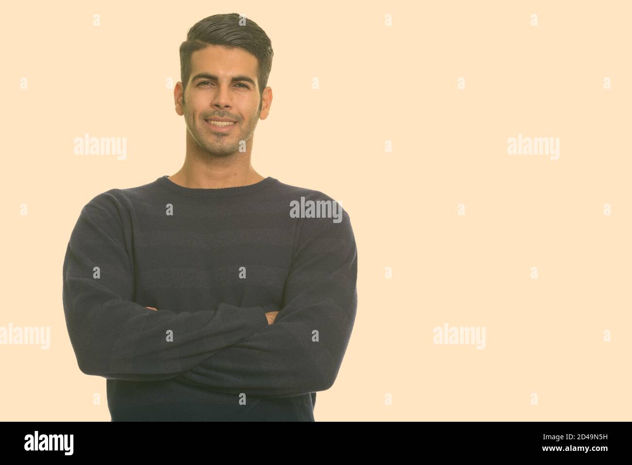Happy persian man smiling arms hi-res stock photography and images - Alamy