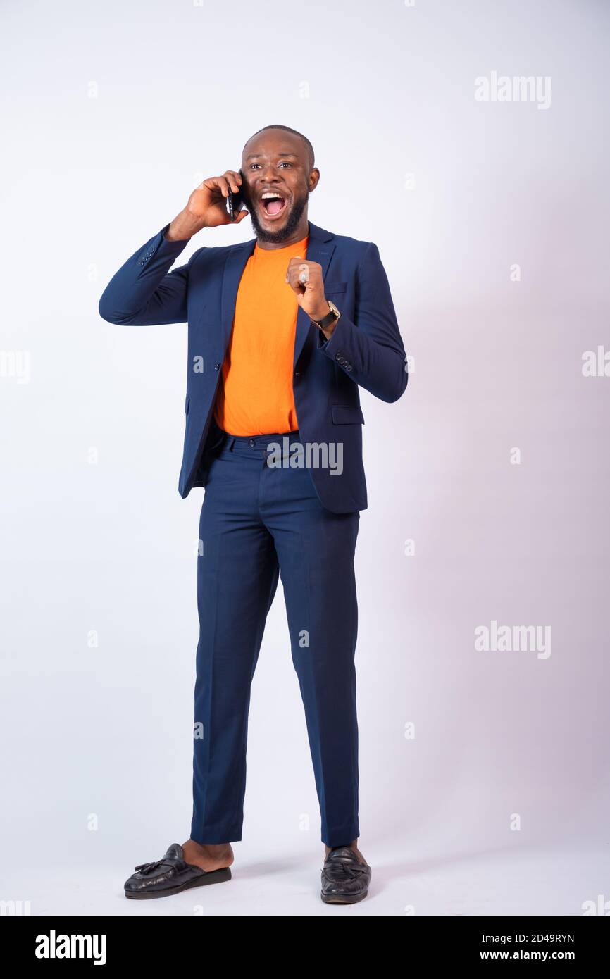 excited business man making a phone call Stock Photo - Alamy
