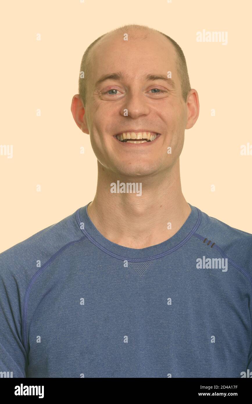 Face of happy bald Caucasian man smiling Stock Photo - Alamy
