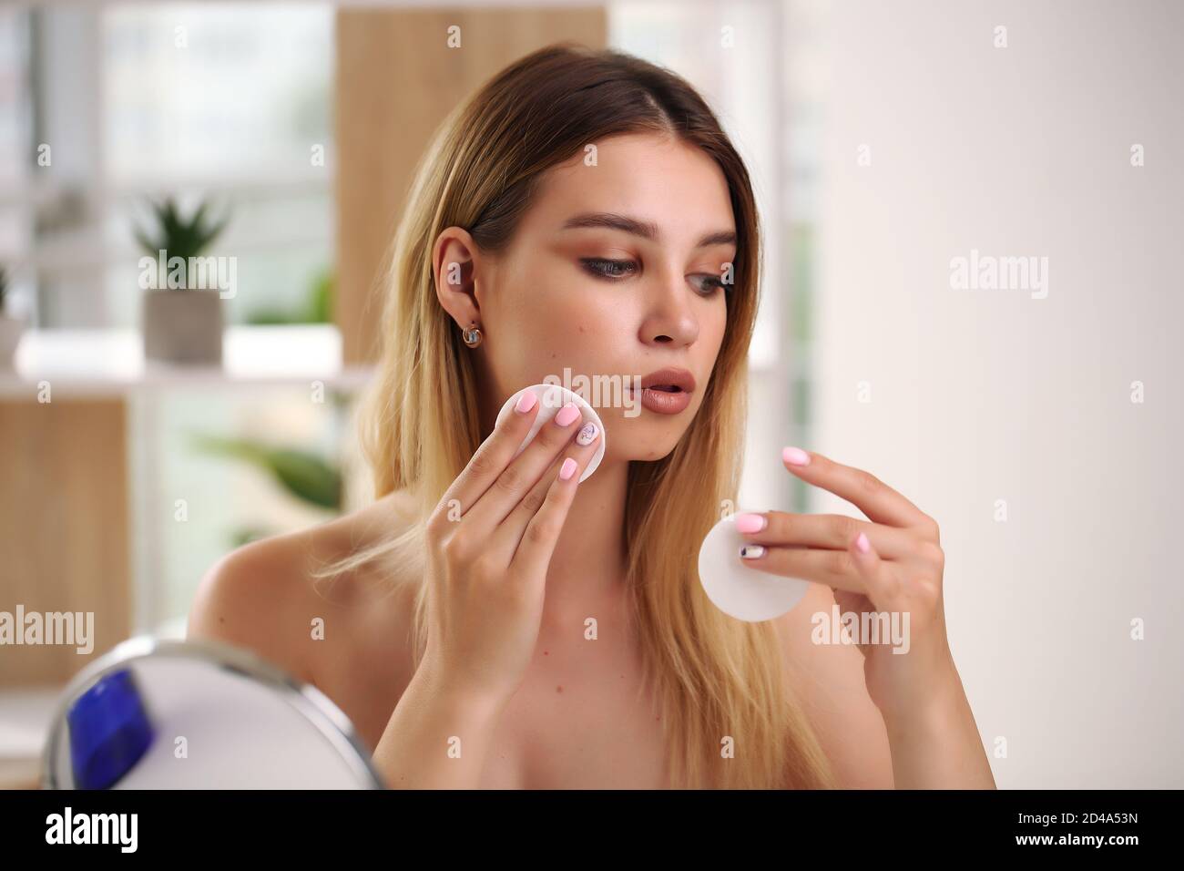 Skincare concept, portrait of happy female applying cosmetic cream on ...