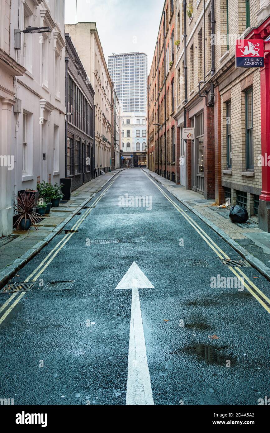 Narrow street in Bloomsbury, London looking towards the Centre Point ...