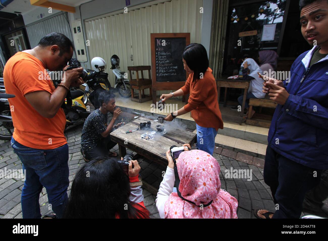 the photographers are taking pictures of the drink and food menu on the ...