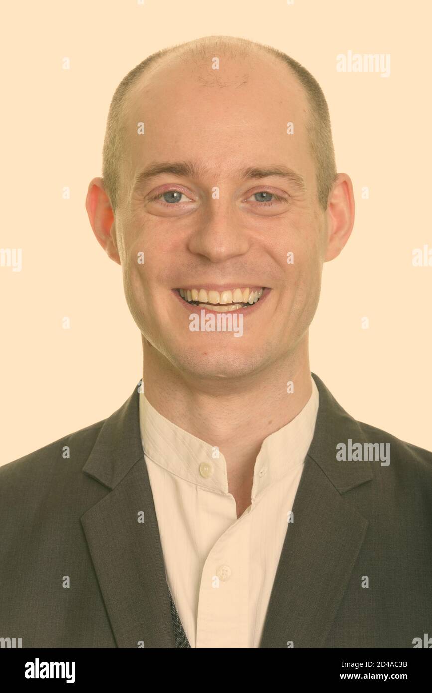 Face of happy bald Caucasian businessman smiling Stock Photo - Alamy