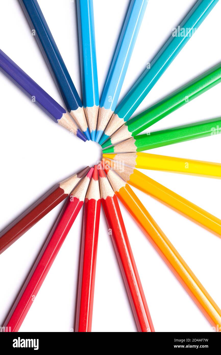 circle or semicircle of colored sharp pencils spouts in the center on a ...