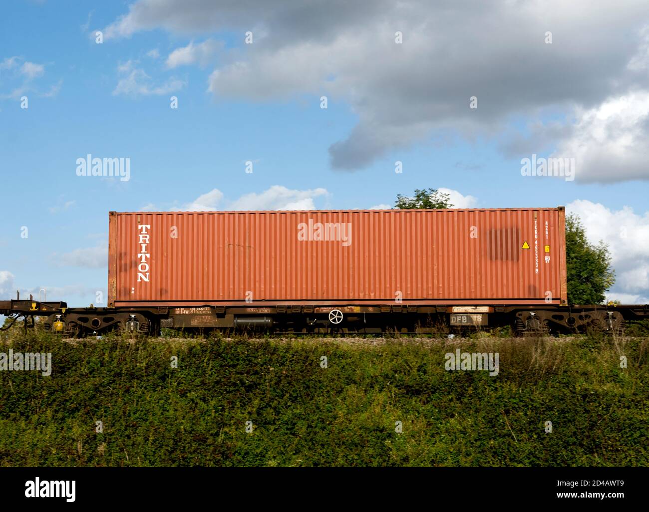Triton shipping container on a freightliner train, Warwickshire, UK ...