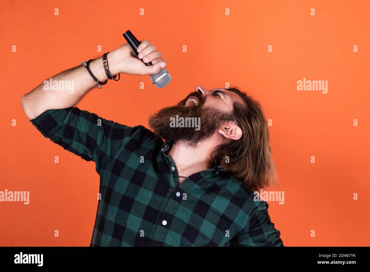 high tune. concept of karaoke. man singer love music. brutal man sing ...