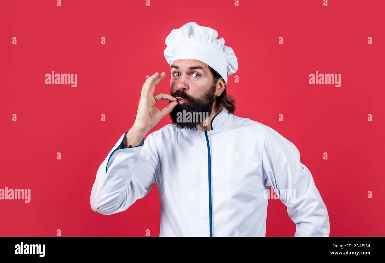 smack of admiration. handsome man with beard and moustache cooking food ...