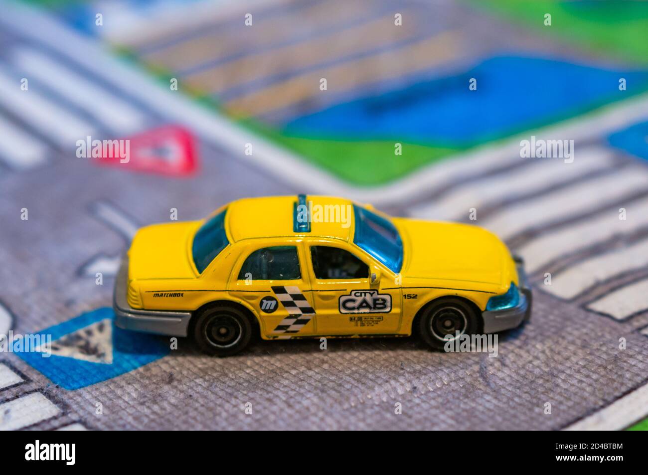 POZNAN, POLAND - Oct 04, 2020: Matchbox yellow model toy cab car on a ...