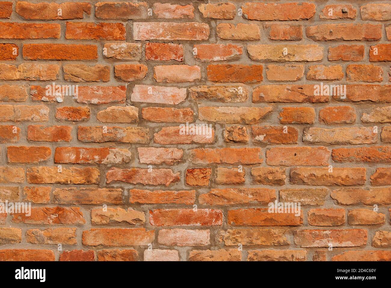 Orange and red brick wall as background Stock Photo - Alamy