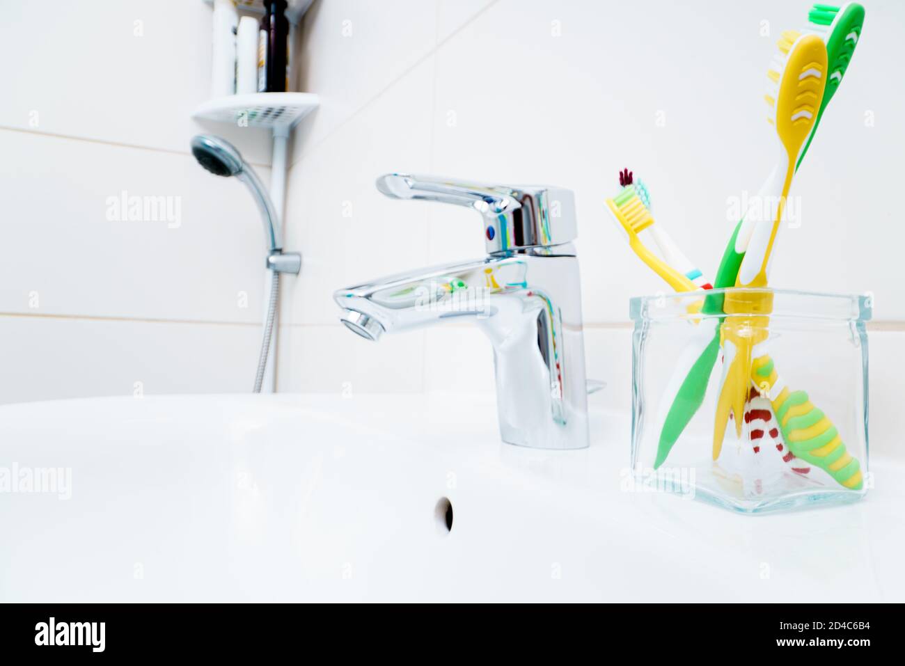 Toothbrush on the sink in the bathroom Stock Photo - Alamy