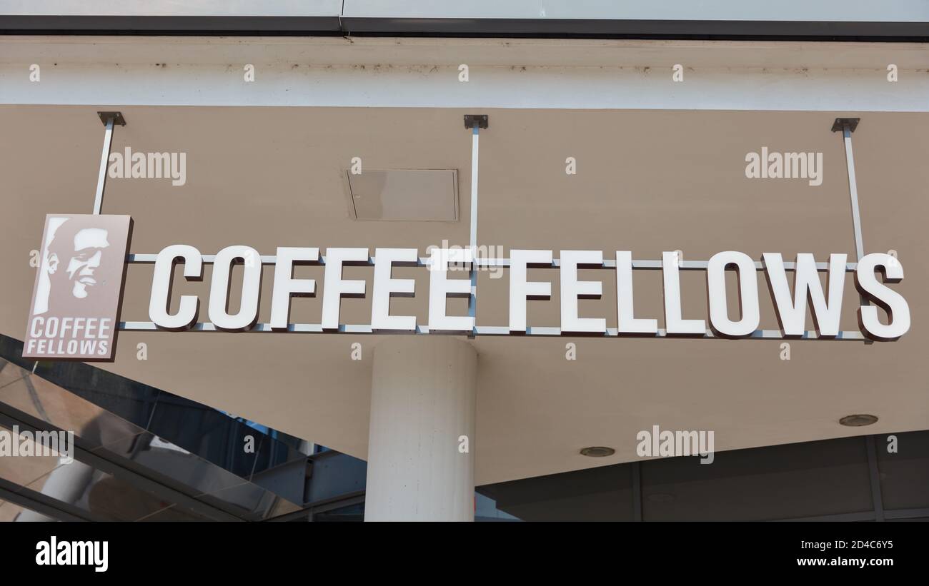 COLOGNE; May 2020: Coffee Fellows brand logo over coffeehouse in ...