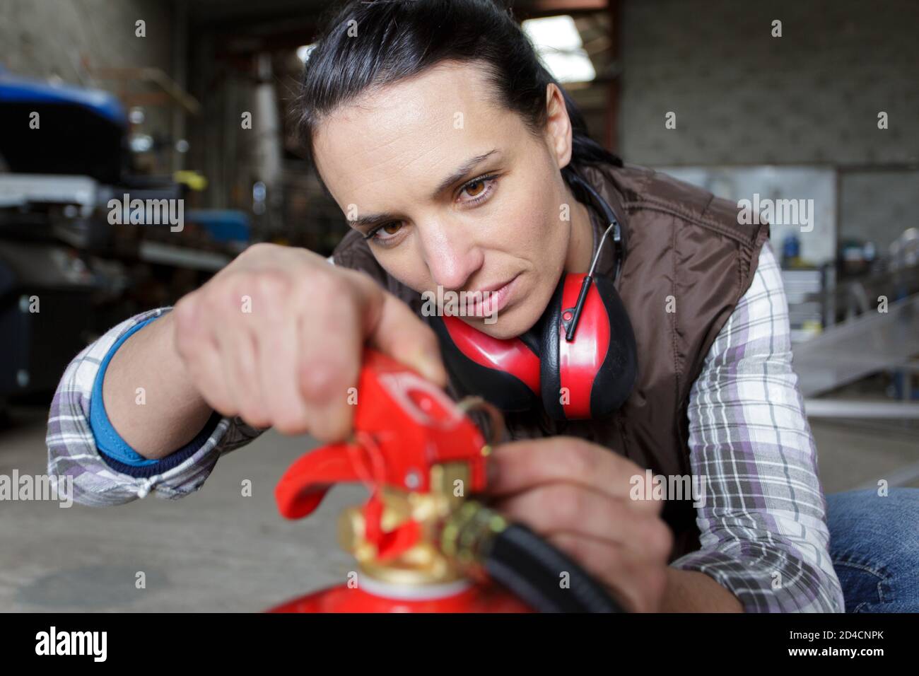 fire extinguisher safety technician Stock Photo - Alamy