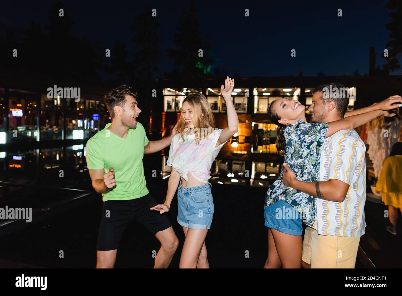 Young people dancing during party outdoors at night Stock Photo - Alamy