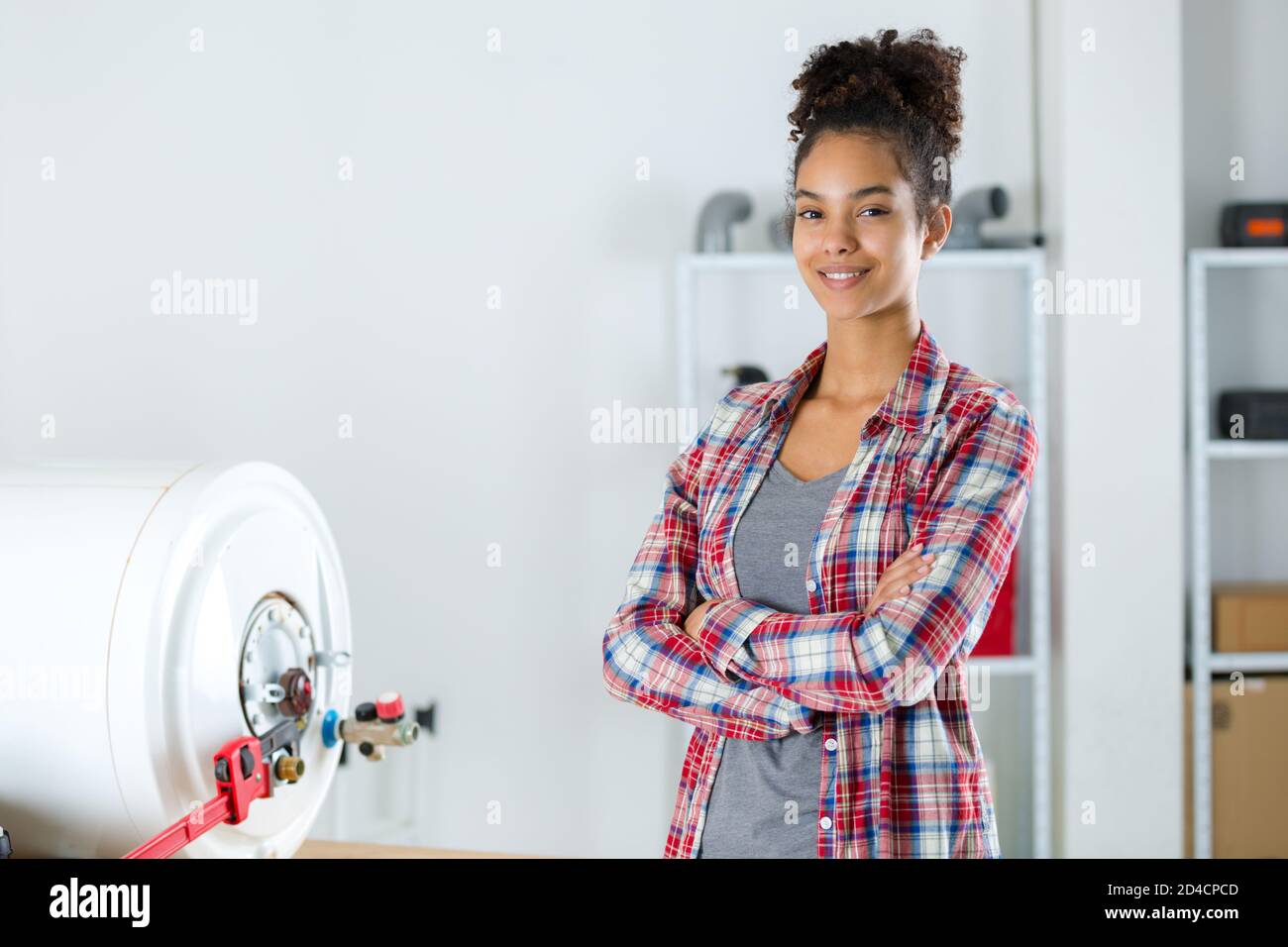Female plumber looking camera hi-res stock photography and images - Alamy