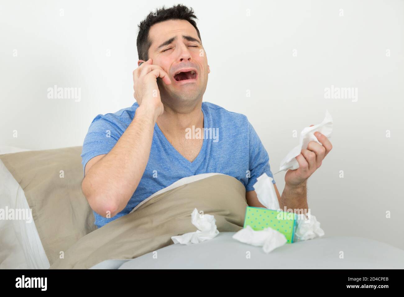 sad single man lamenting on the bed Stock Photo - Alamy