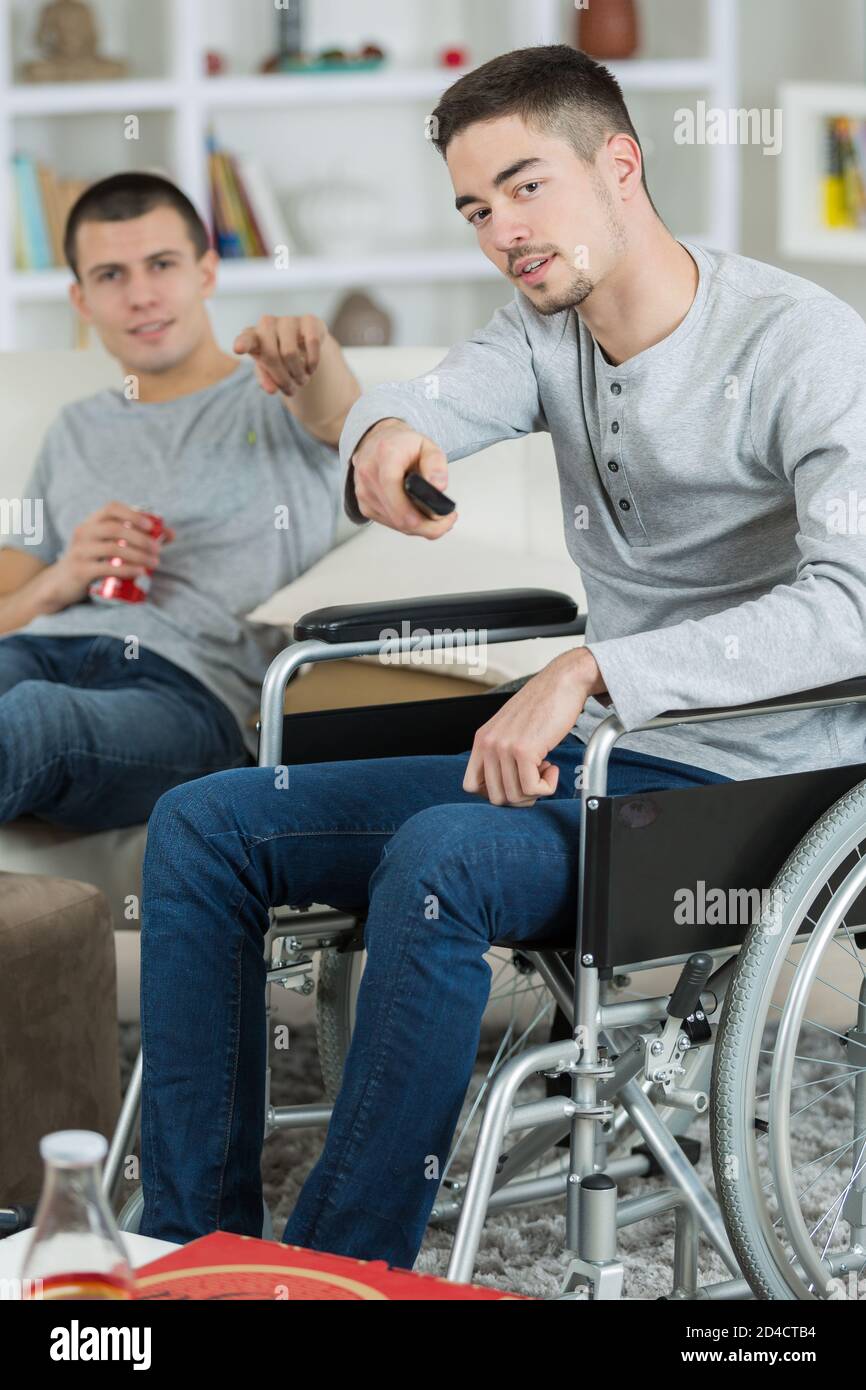 Disabled young man watching movie hi-res stock photography and images ...