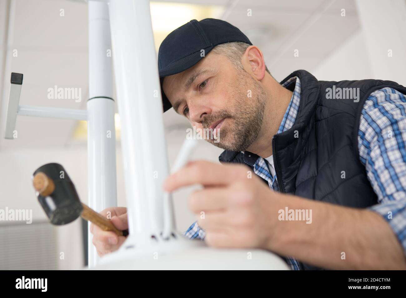 Man repairing sofa hi-res stock photography and images - Alamy