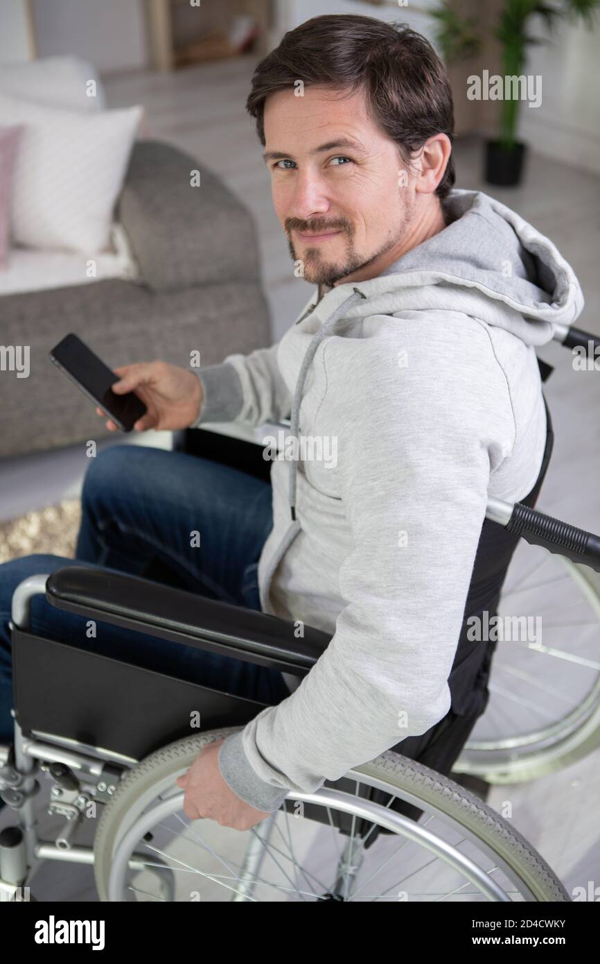 disabled man watching sports on tv Stock Photo - Alamy