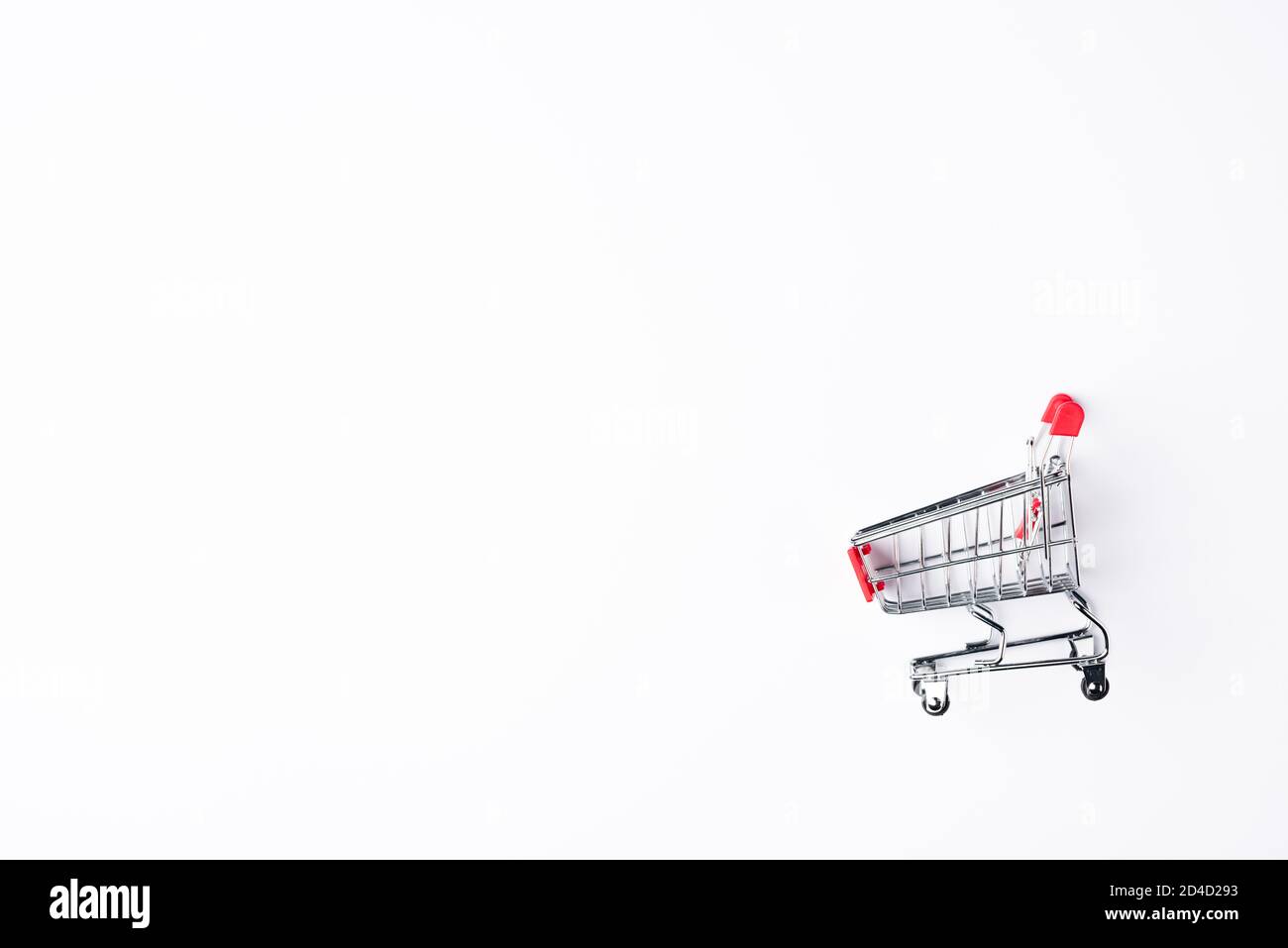 Top view of toy shopping cart on white background Stock Photo - Alamy