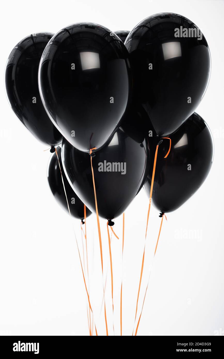 Decorative black balloons on strings isolated on white Stock Photo - Alamy
