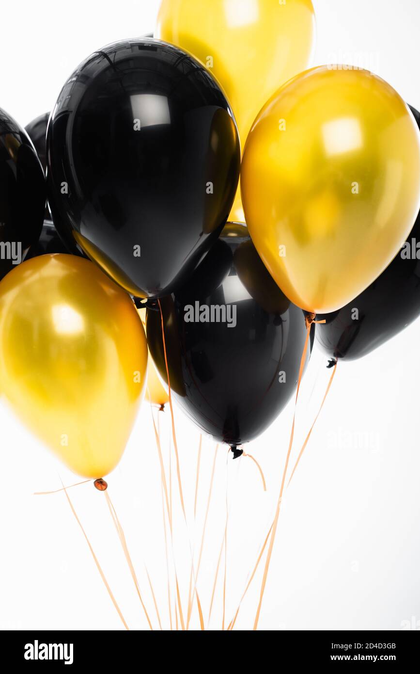 Festive balloons on strings isolated on white Stock Photo - Alamy