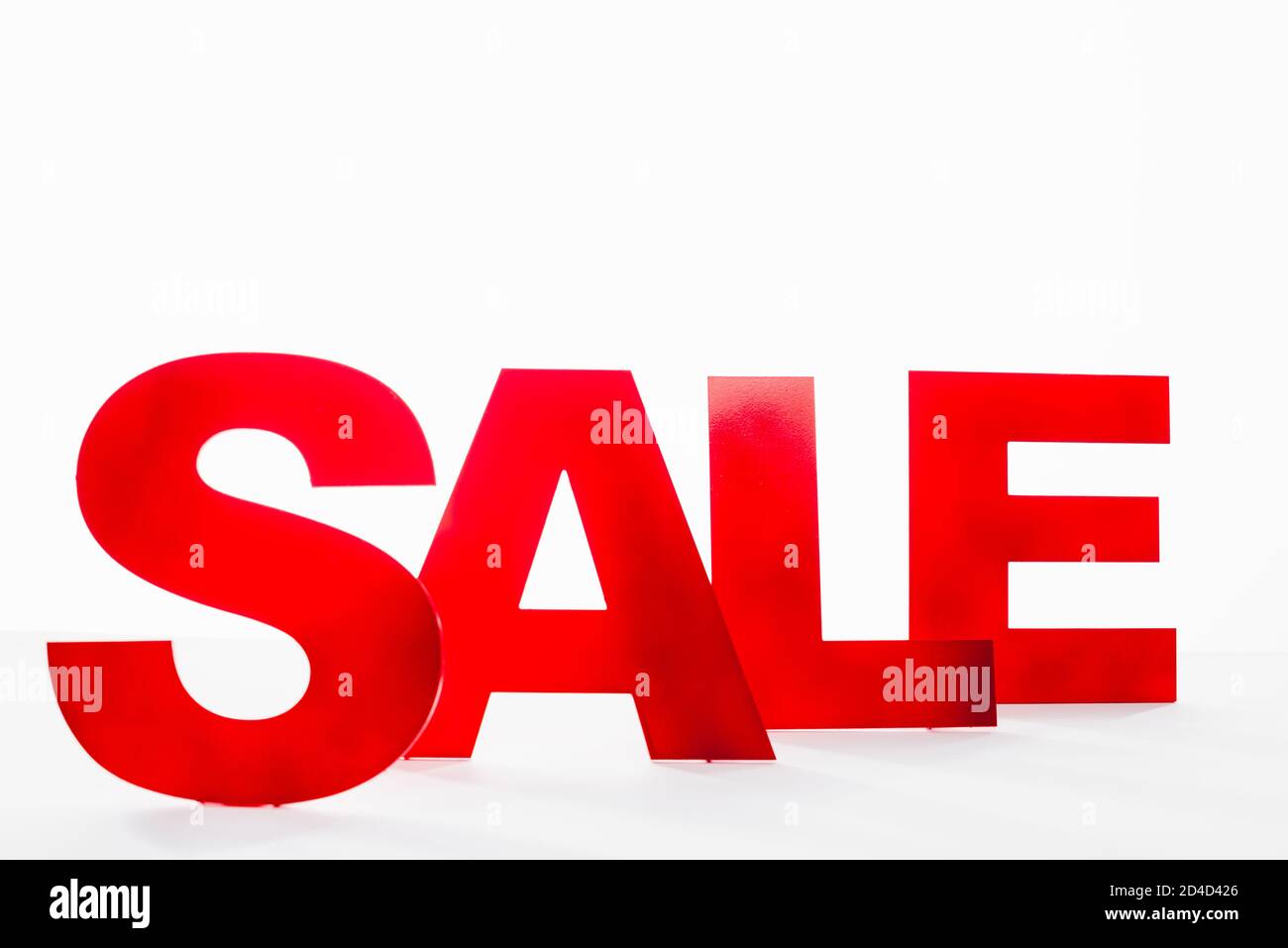 Red sale lettering on white background Stock Photo - Alamy