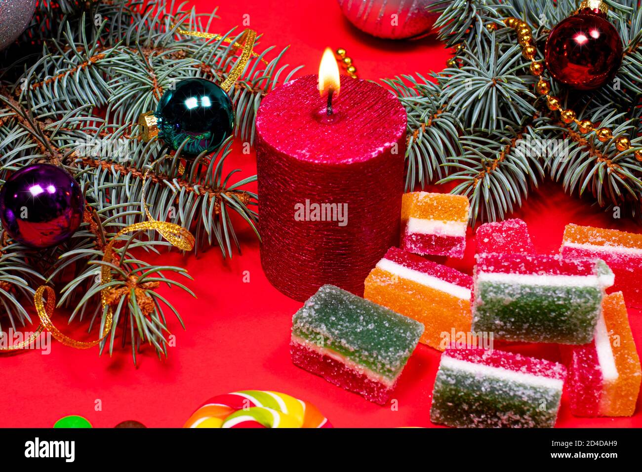 Marmalade on a red background with a burning candle. Banner for ...