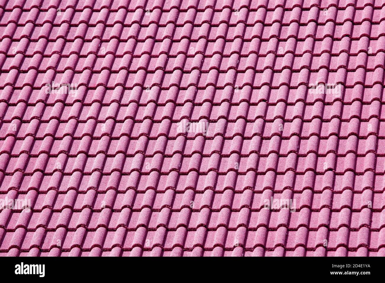 Decorative pink tiles on the roof of the house Stock Photo - Alamy