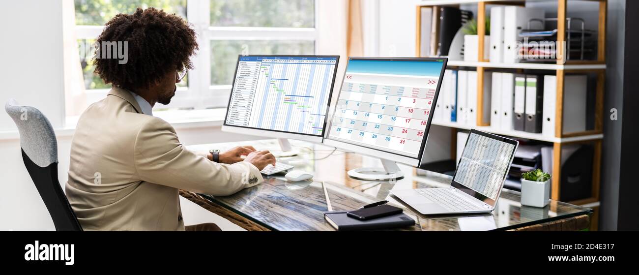 Gantt Schedule Plan On Computer Screen In Office Stock Photo - Alamy