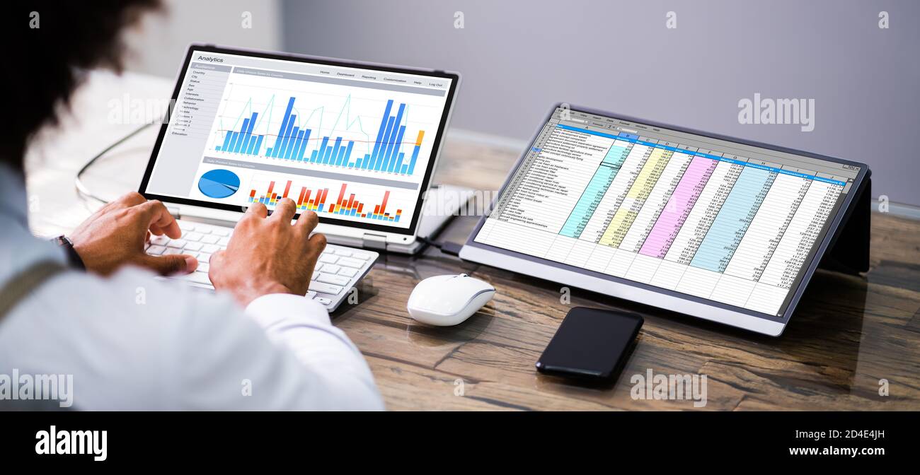 Analyst Working With Spreadsheet Data On Computer Stock Photo - Alamy