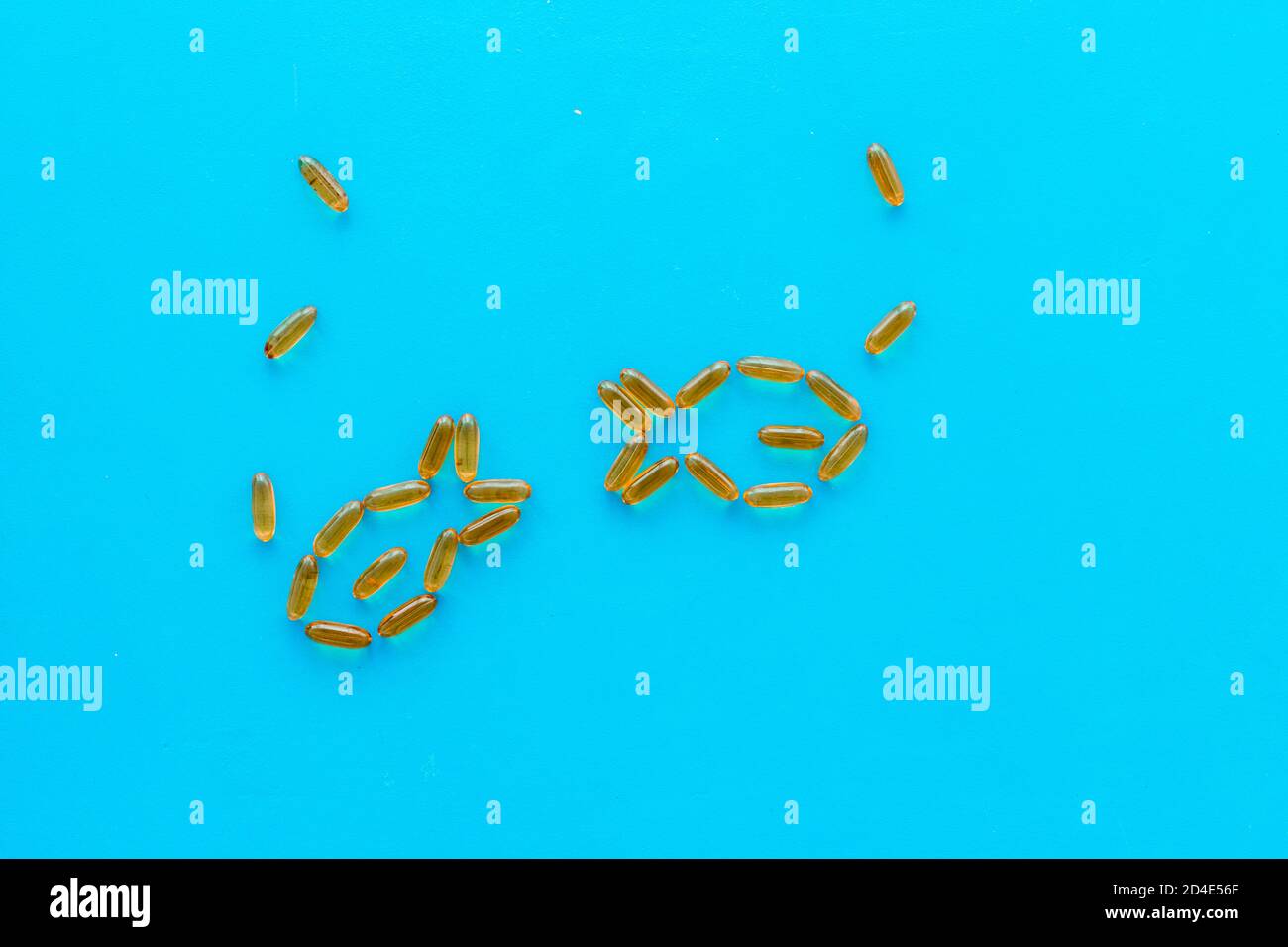 Omega3 capsules cod liver oil, fish shape. Top view Stock Photo - Alamy