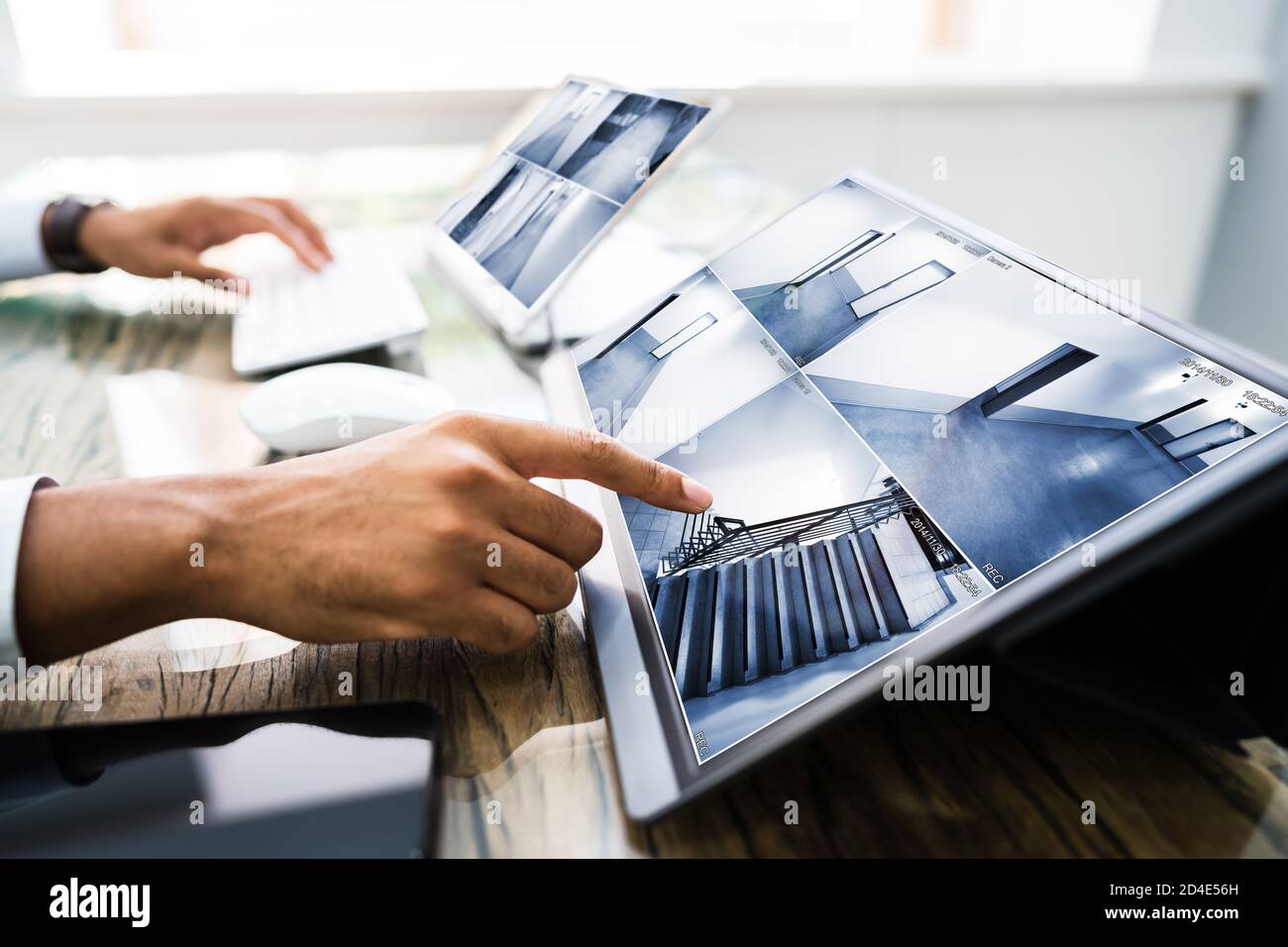Security Guard Looking At CCTV Surveillance Video Footage Stock Photo ...