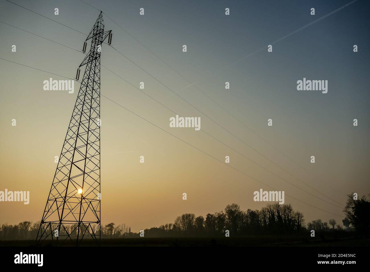 electricity pylons at sunset, digital photo picture as a background ...