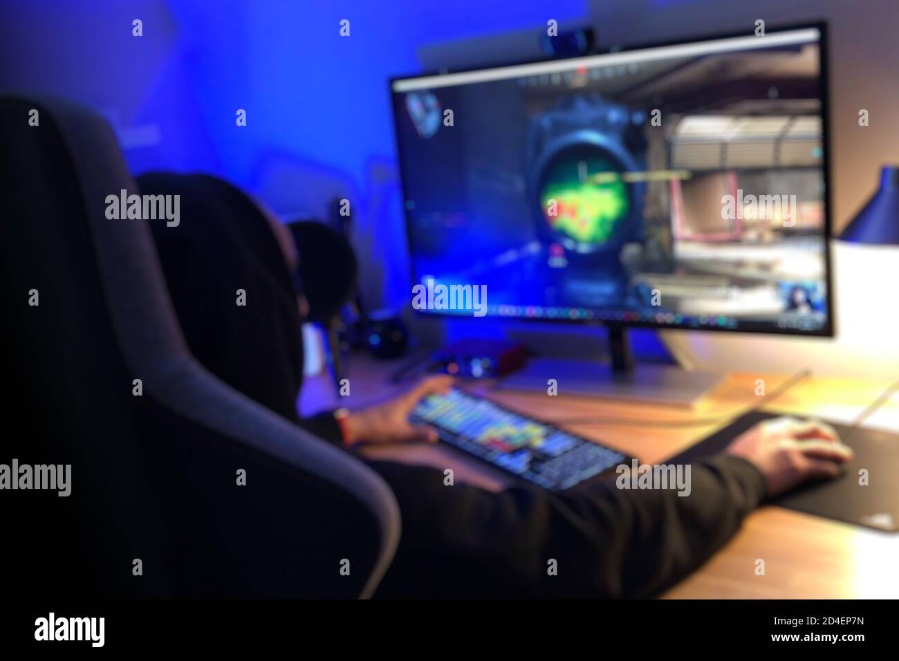 Teenage PC Gamer Playing First-Person Shooter in Subdued Light Stock ...