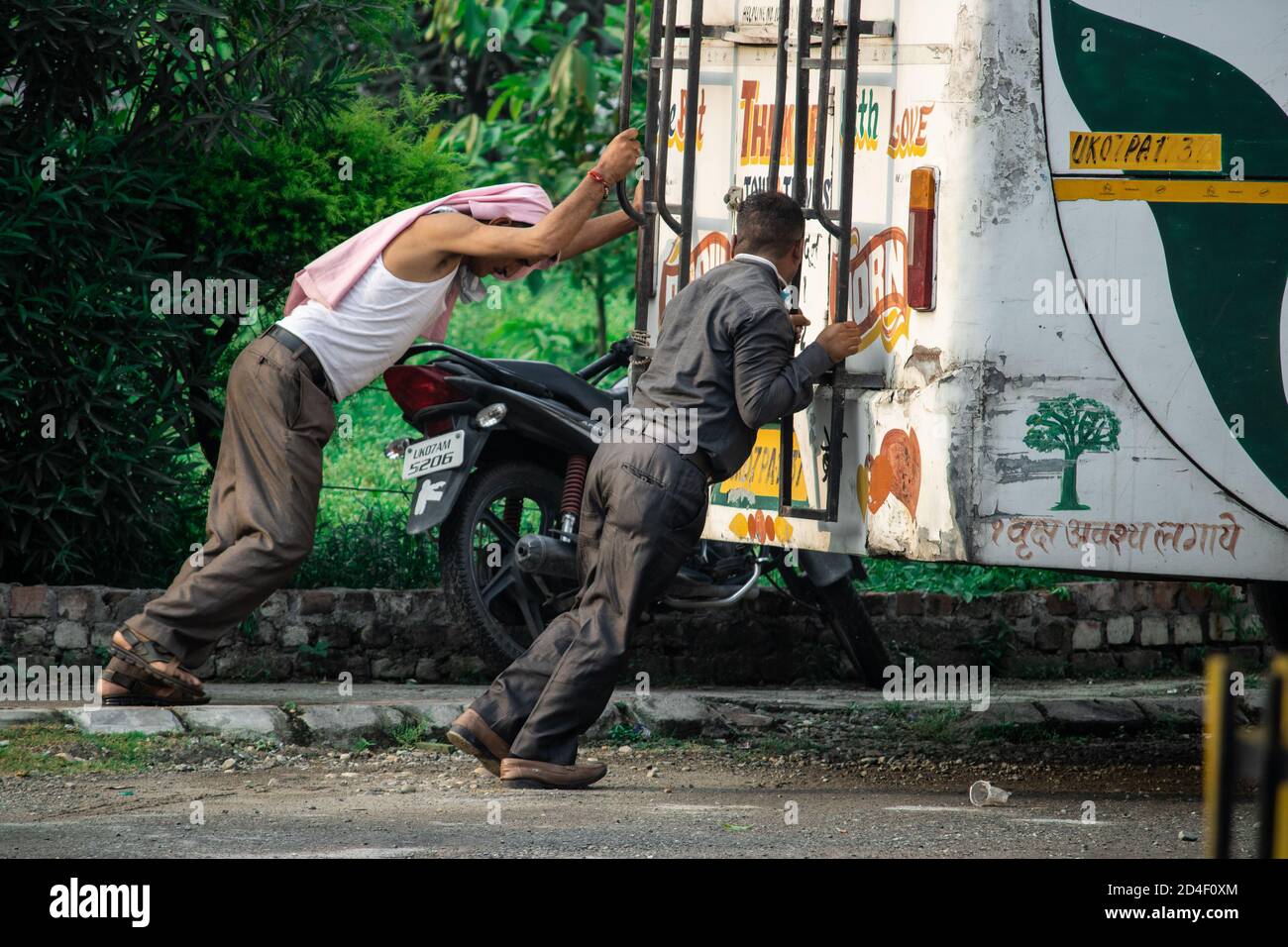 Pushing bus hi-res stock photography and images - Alamy