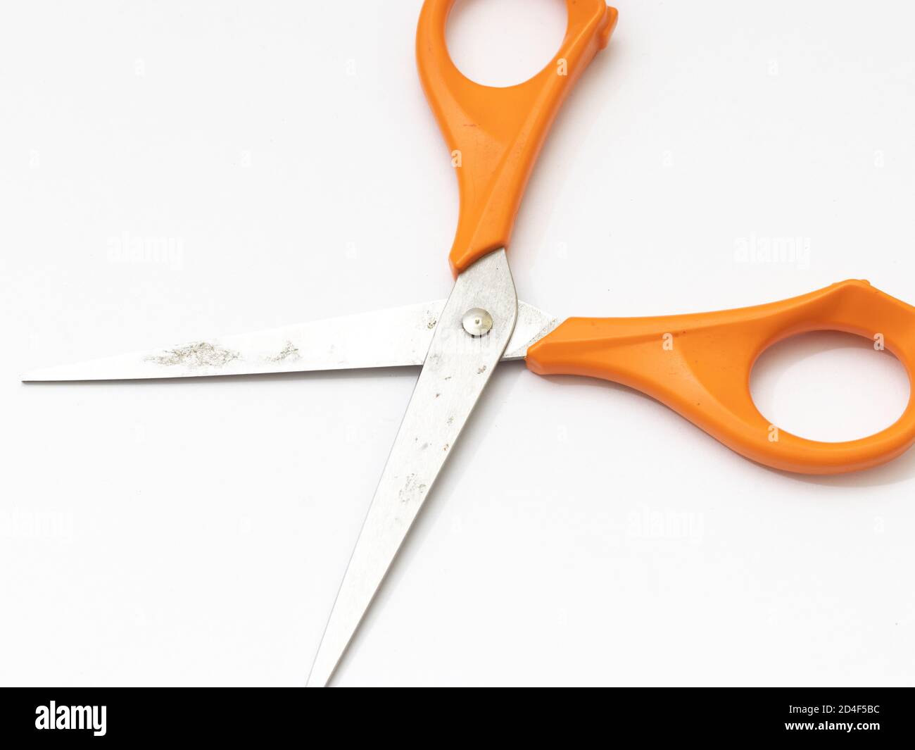 Orange scissor with white background Stock Photo - Alamy