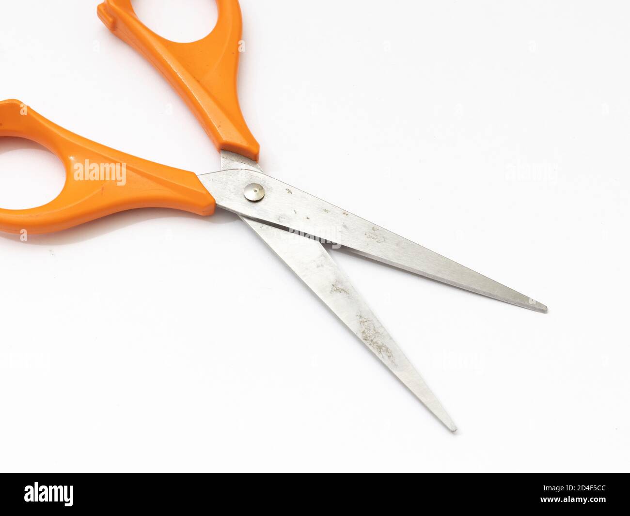 Orange scissor with white background Stock Photo - Alamy