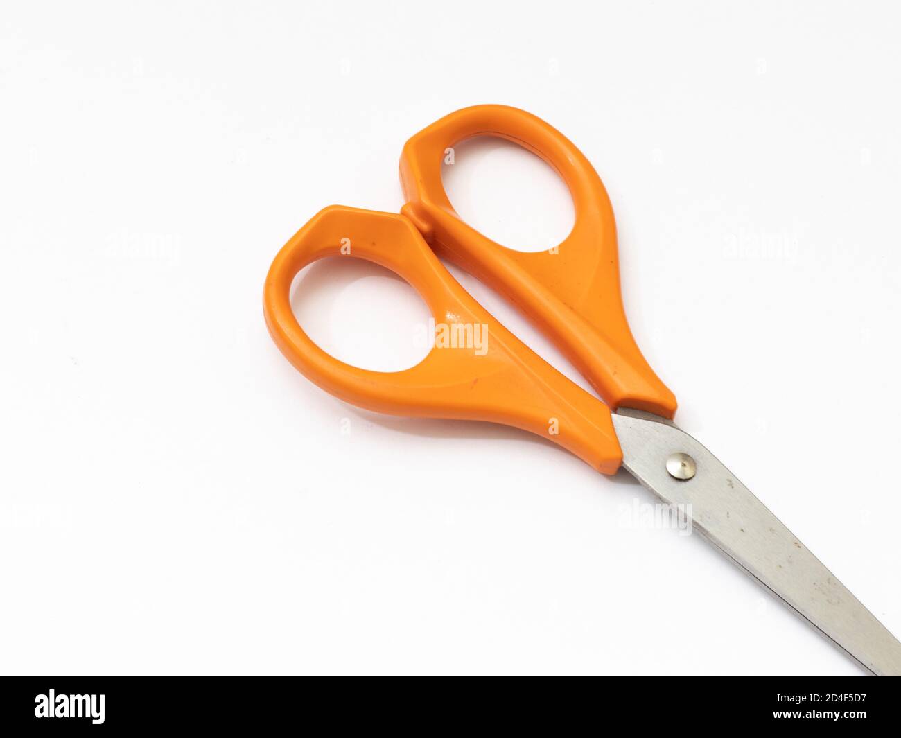 Orange scissor with white background Stock Photo - Alamy