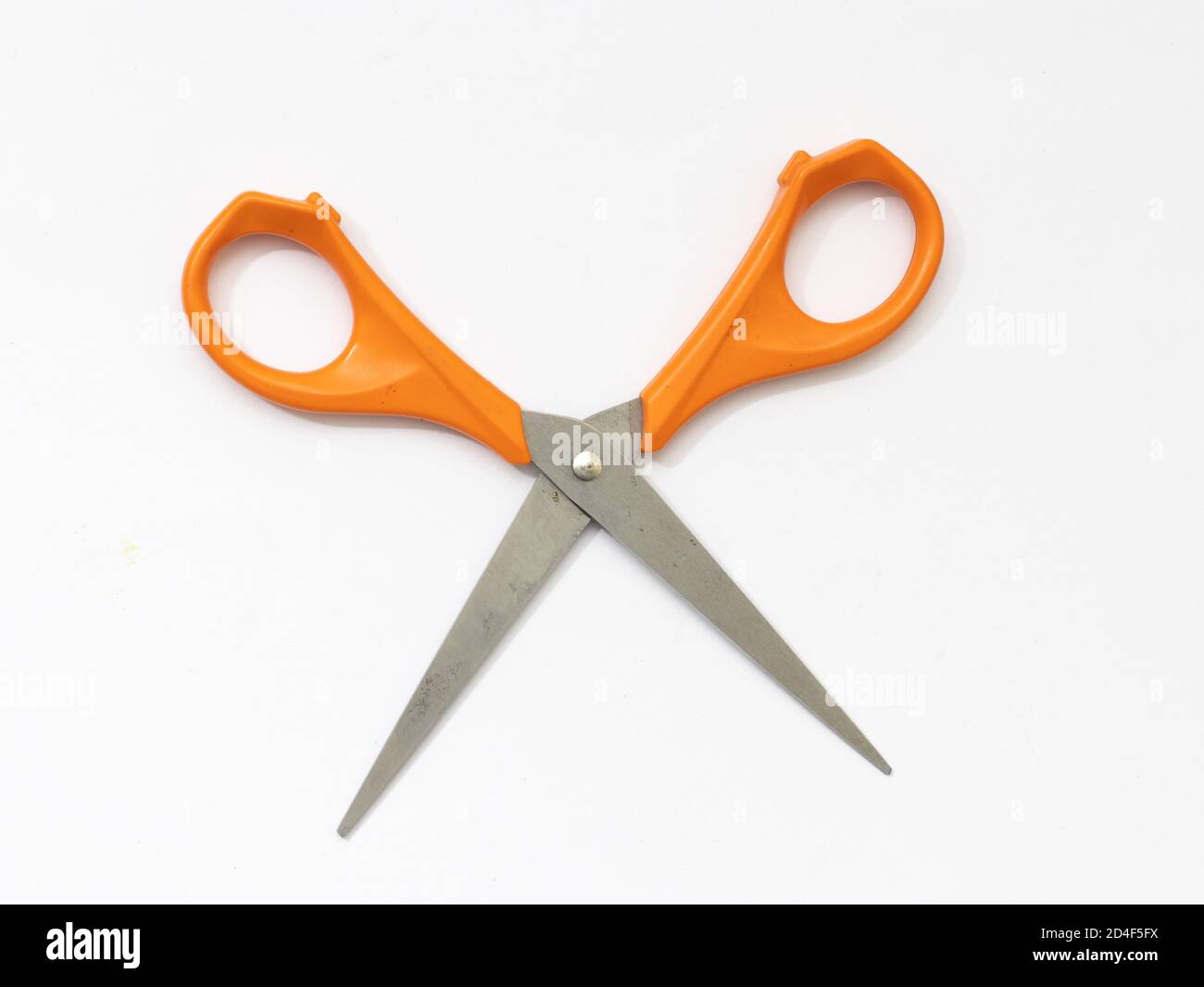 Orange scissor with white background Stock Photo - Alamy