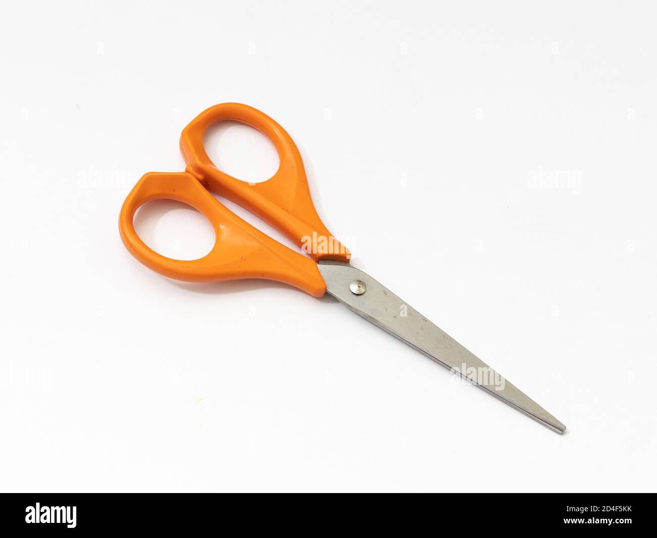 Orange scissor with white background Stock Photo - Alamy