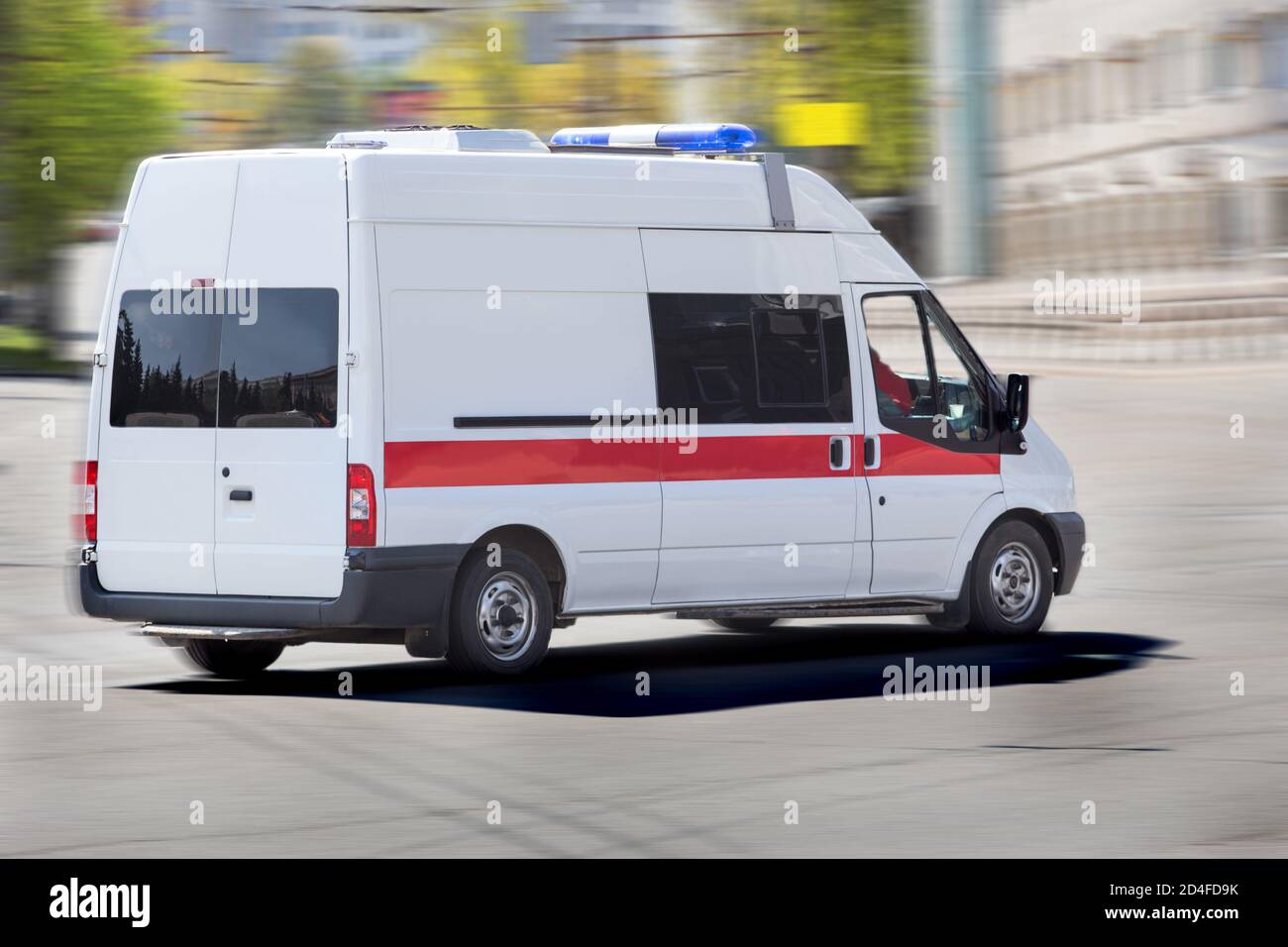 car of an emergency medical service goes on the city street Stock Photo ...