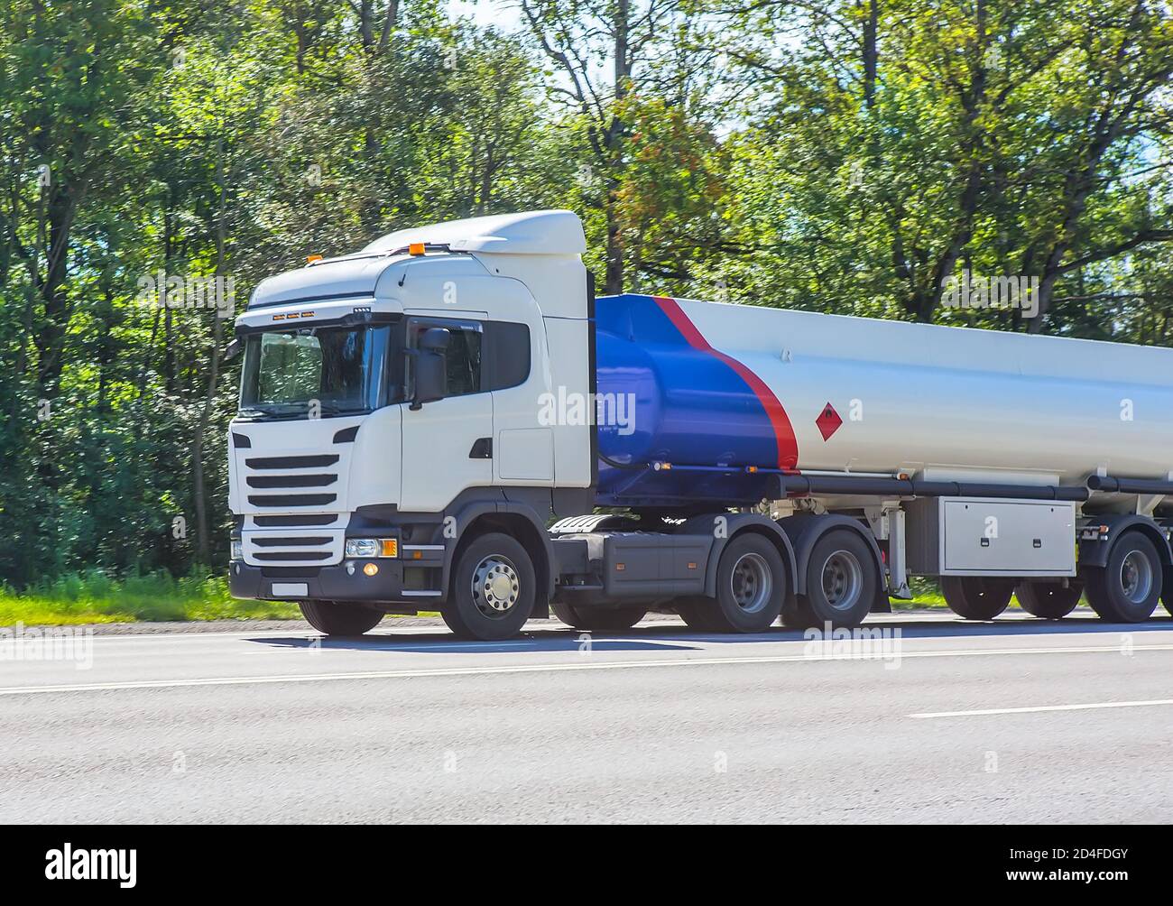 big gas-tank truck goes on highway Stock Photo - Alamy