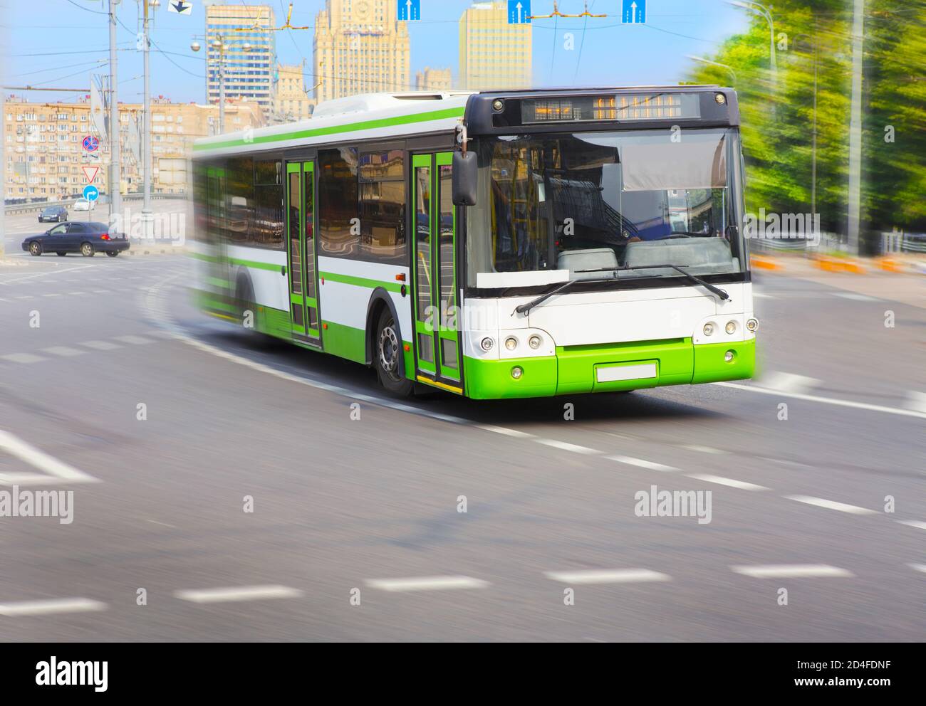 white city bus goes along street Stock Photo - Alamy