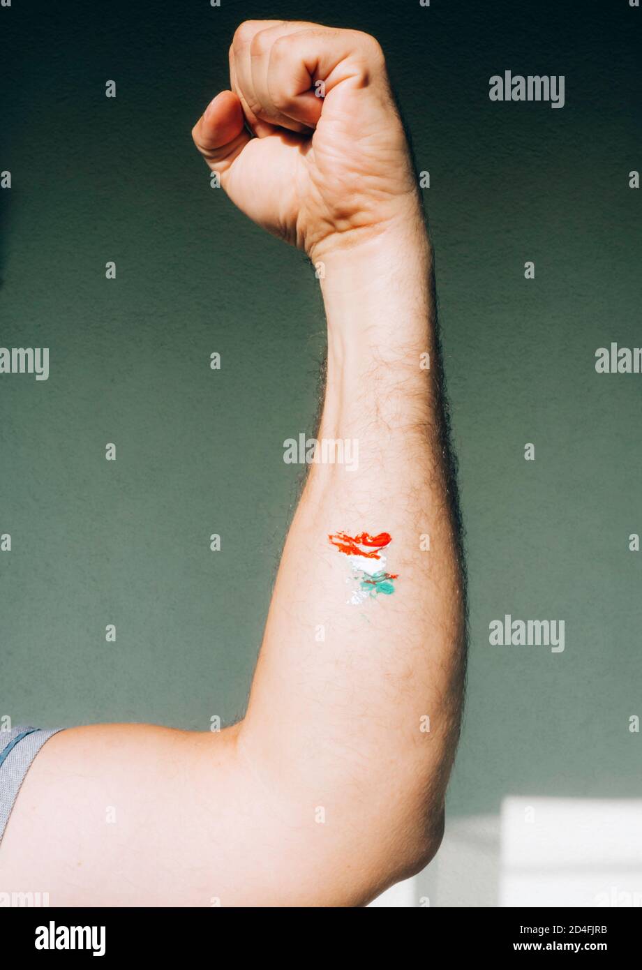 Painted flag tricolour green, white, red colors of Italy on strong man ...