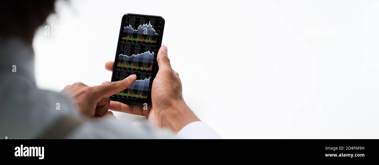 Broker Trading Online On Stock Exchange Using Mobile Phone Stock Photo ...