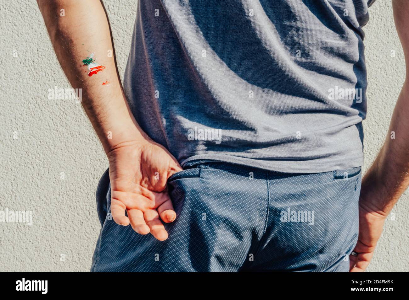 Painted flag tricolour green, white, red colors of Italy on strong man ...