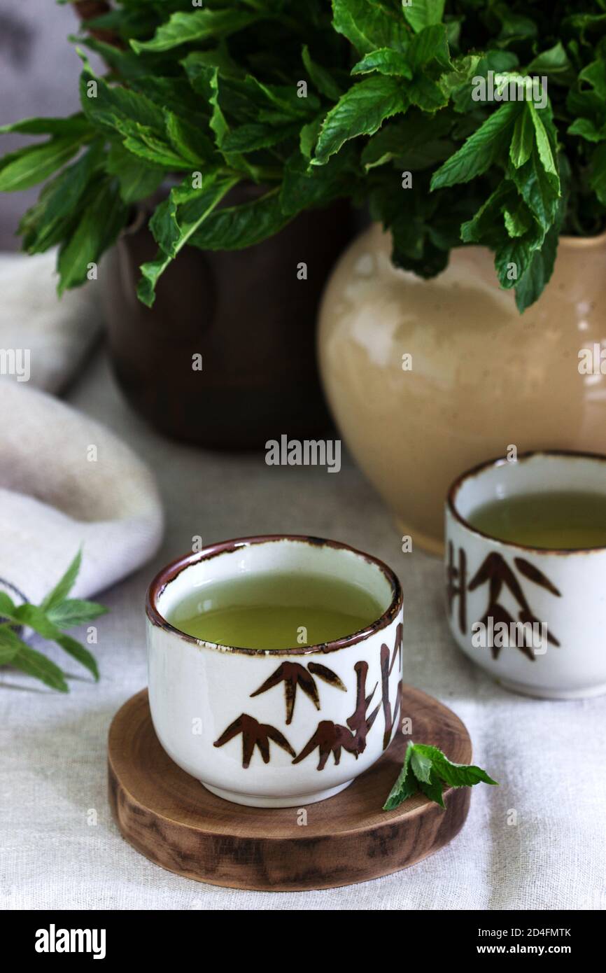 Mint tea in a vintage Chinese tea set, and a mint bouquet in a jug ...