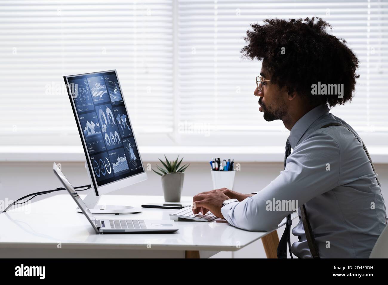 Business Data Analyst Using Computer. African American Advisor Stock ...